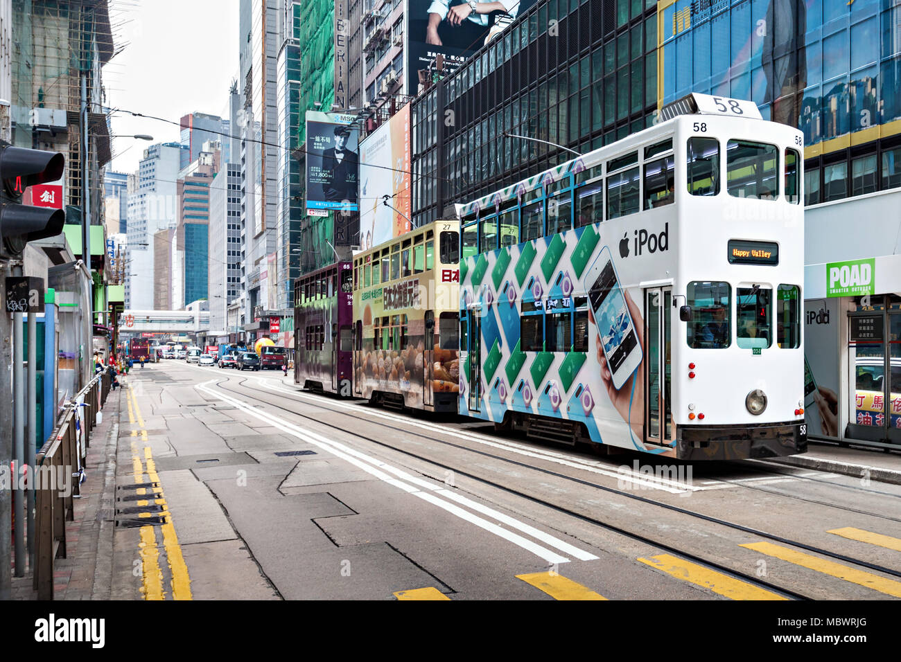HONG KONG - FEBRUARY 21: Double trams with advertisements at Hennessy ...
