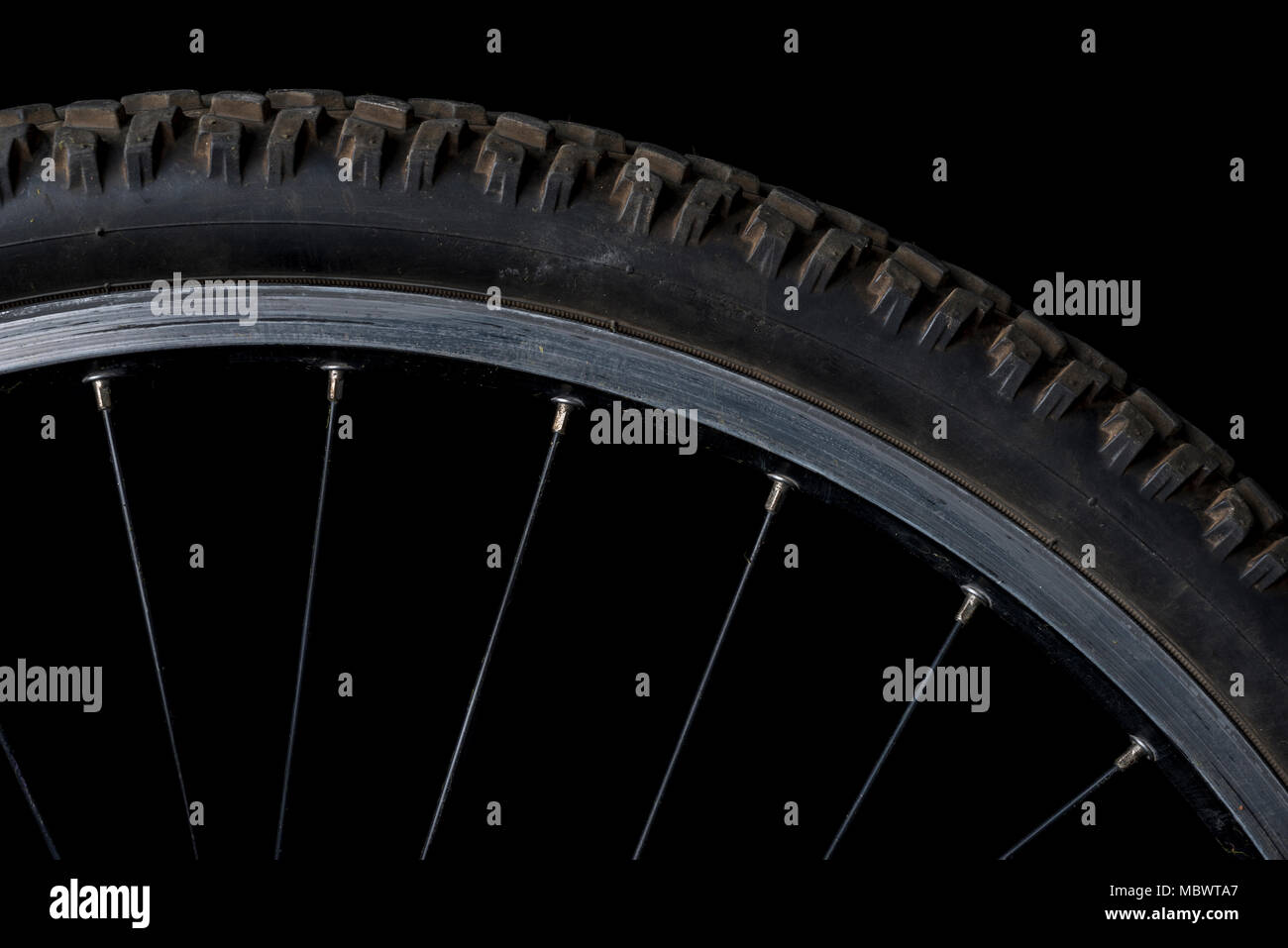 Sector of a bicycle wheel on a black background Stock Photo - Alamy
