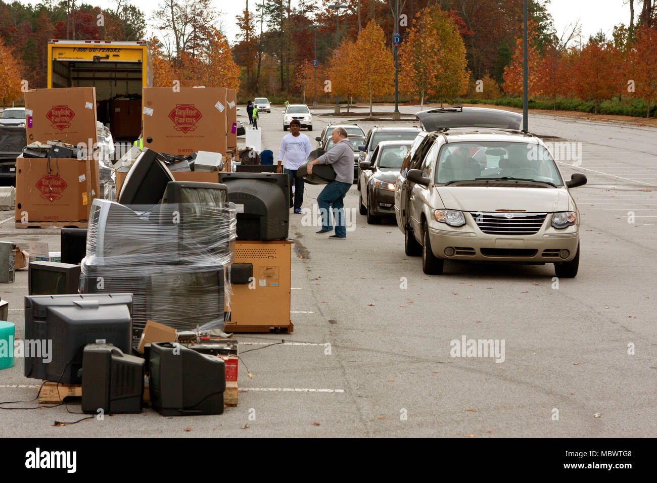Cars line up to drop off items to be recycled, at Gwinnett County's ...