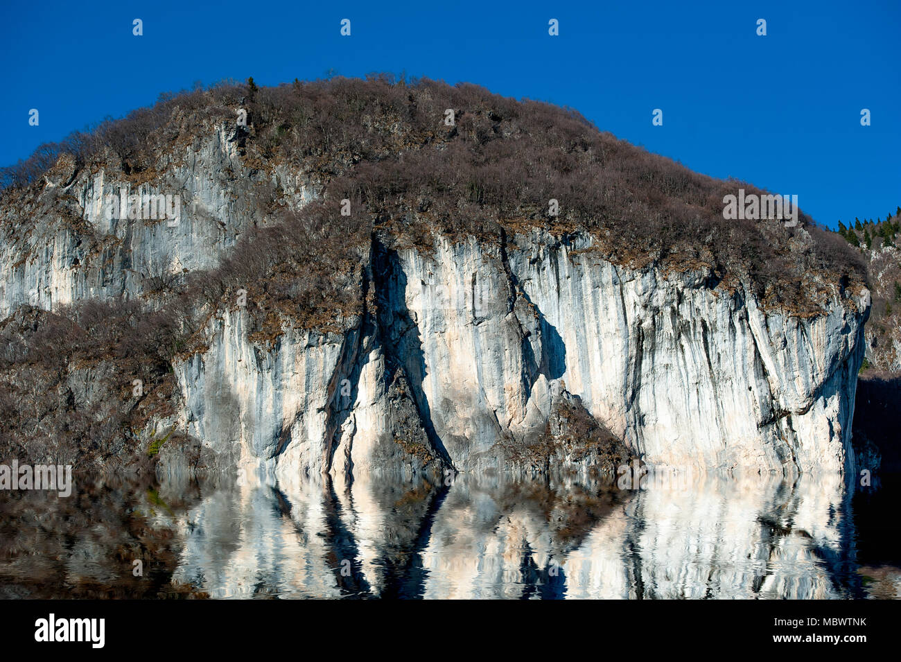 rocky coastline with sheer cliffs Stock Photo - Alamy