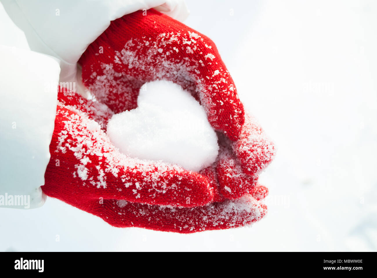 Heart snow glove hi-res stock photography and images - Alamy