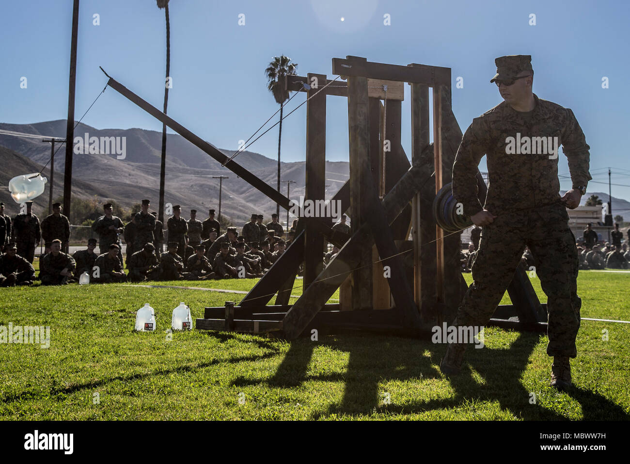 A U.S. Marine with 11th Marine Regiment, 1st Marine Division, fires a ...