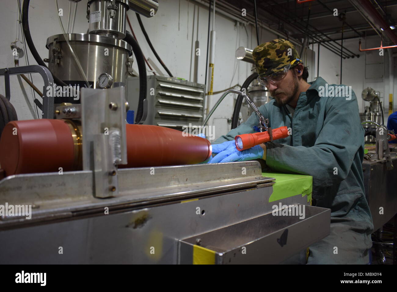 Crane Army employees manufacture rounds for the MK 45 five-inch gun ...