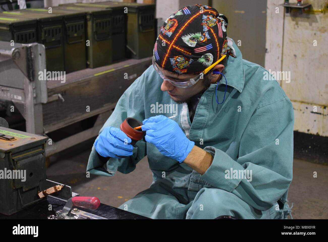 Crane Army employees manufacture rounds for the MK 45 five-inch gun ...
