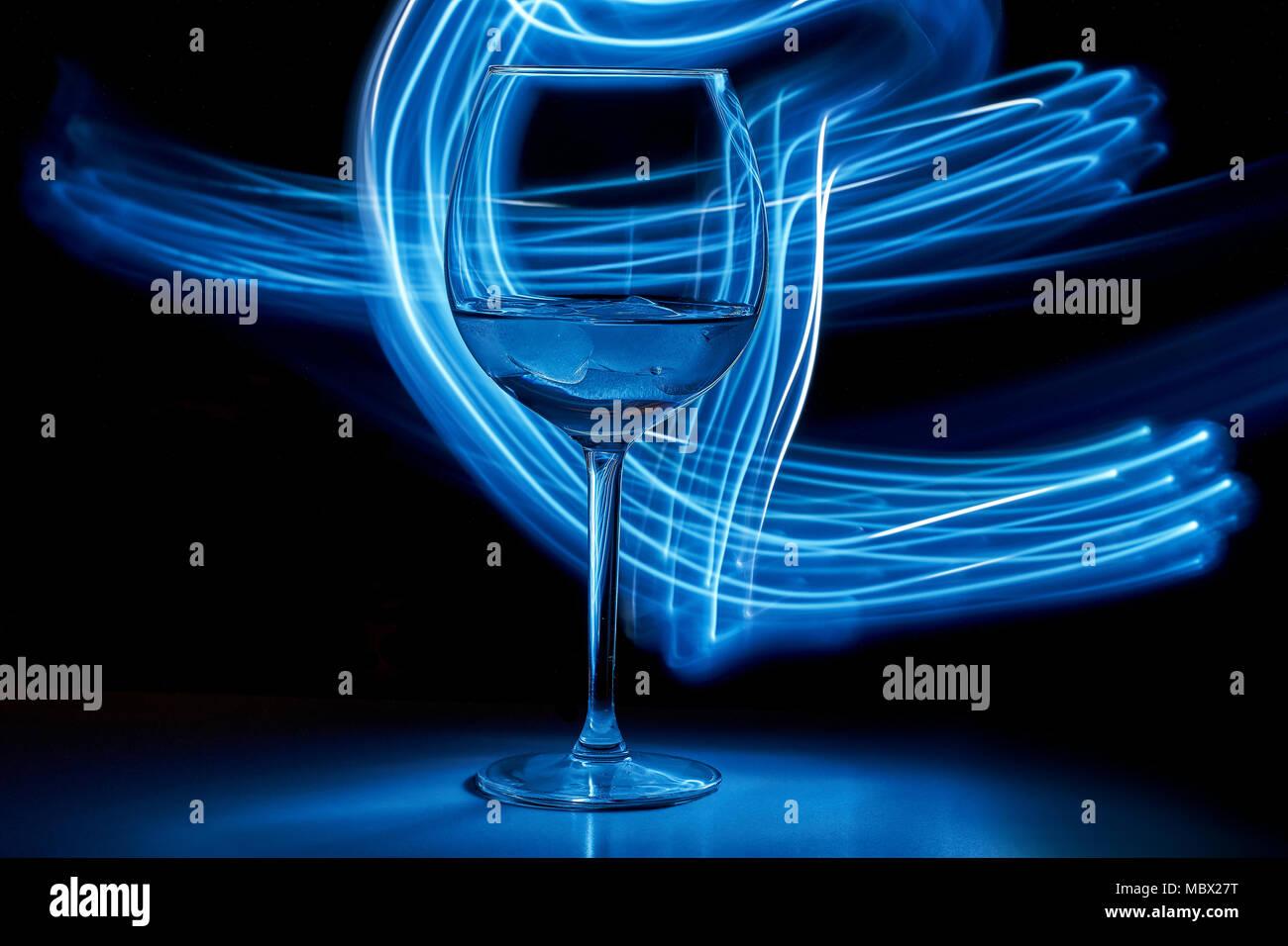 Glass with blue backlight Stock Photo - Alamy
