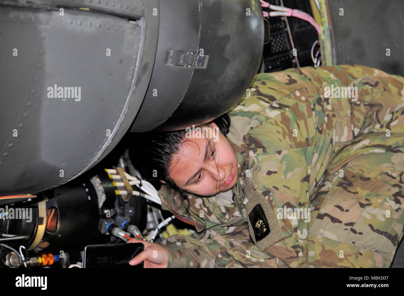 U.S. Army Pfc. Britney Moody, an AH-64D Apache Longbow helicopter ...