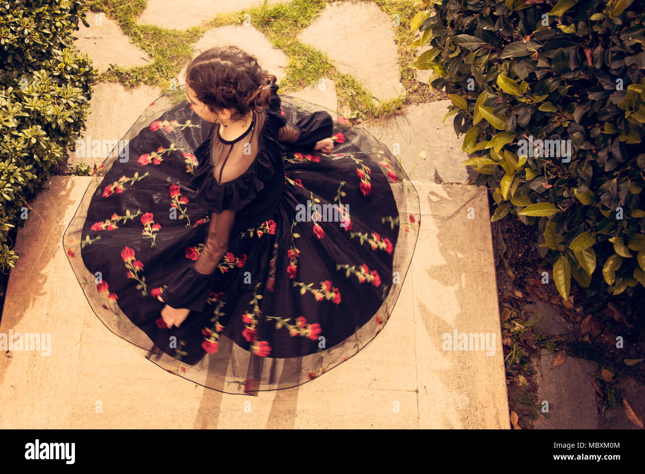 Young girl spinning Stock Photo - Alamy