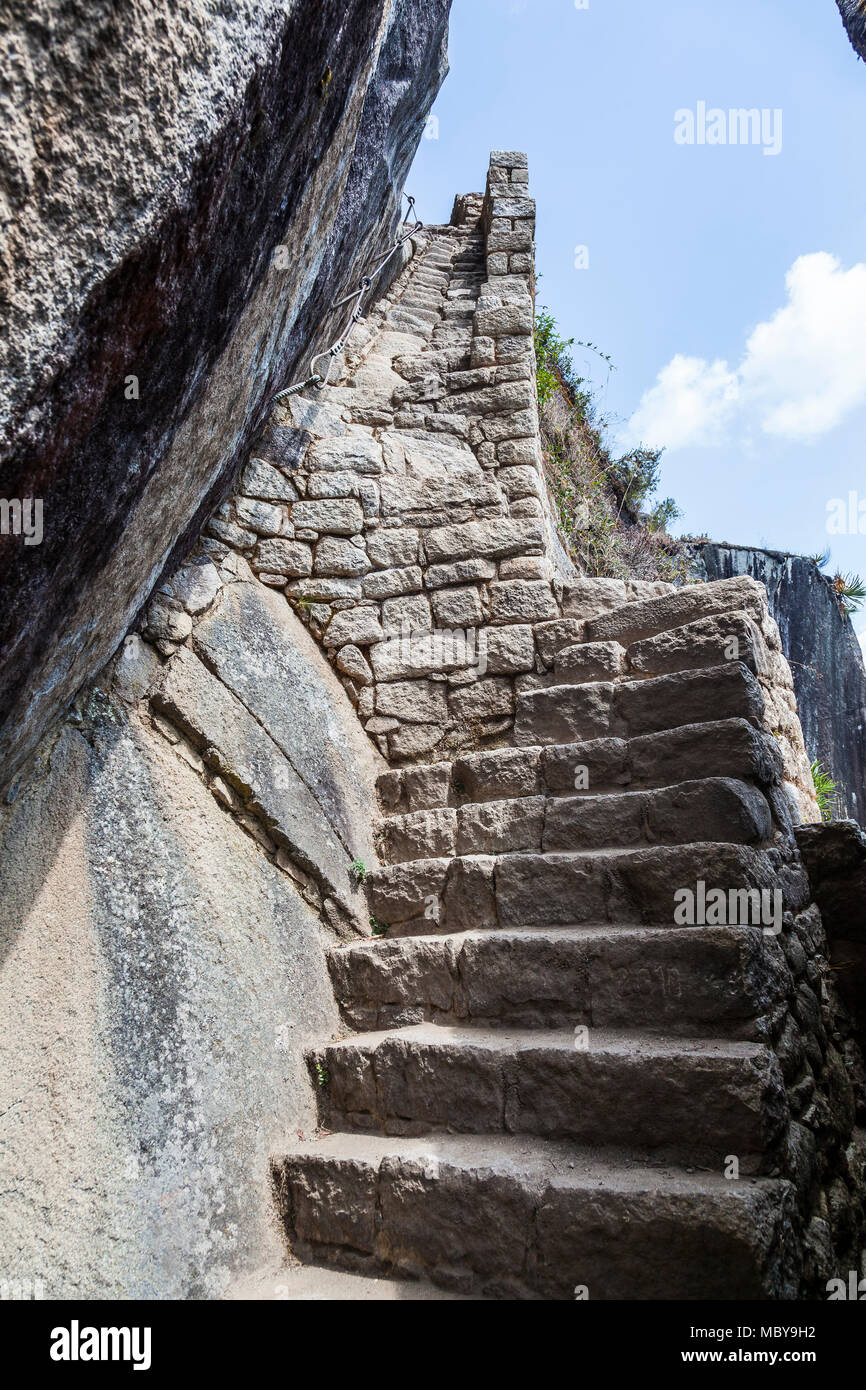 Steps carved into the rock in Machu Picchu, was designed Peruvian ...