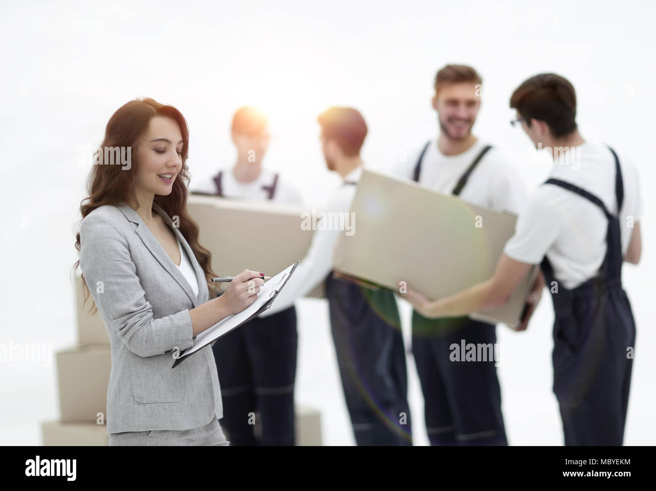 Businessman with documents, creating a stack of cardboard boxes Stock ...