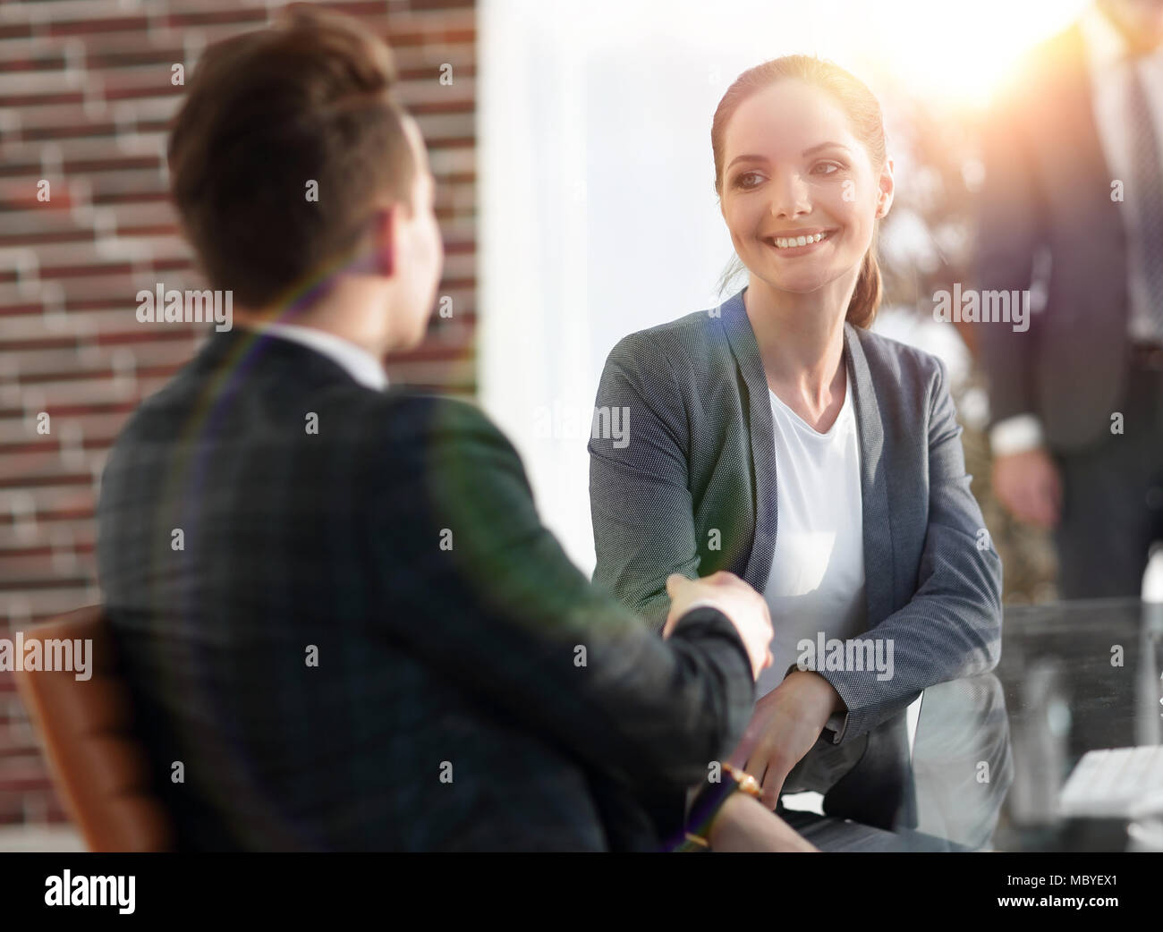 handshake Manager and the client in the office Stock Photo - Alamy