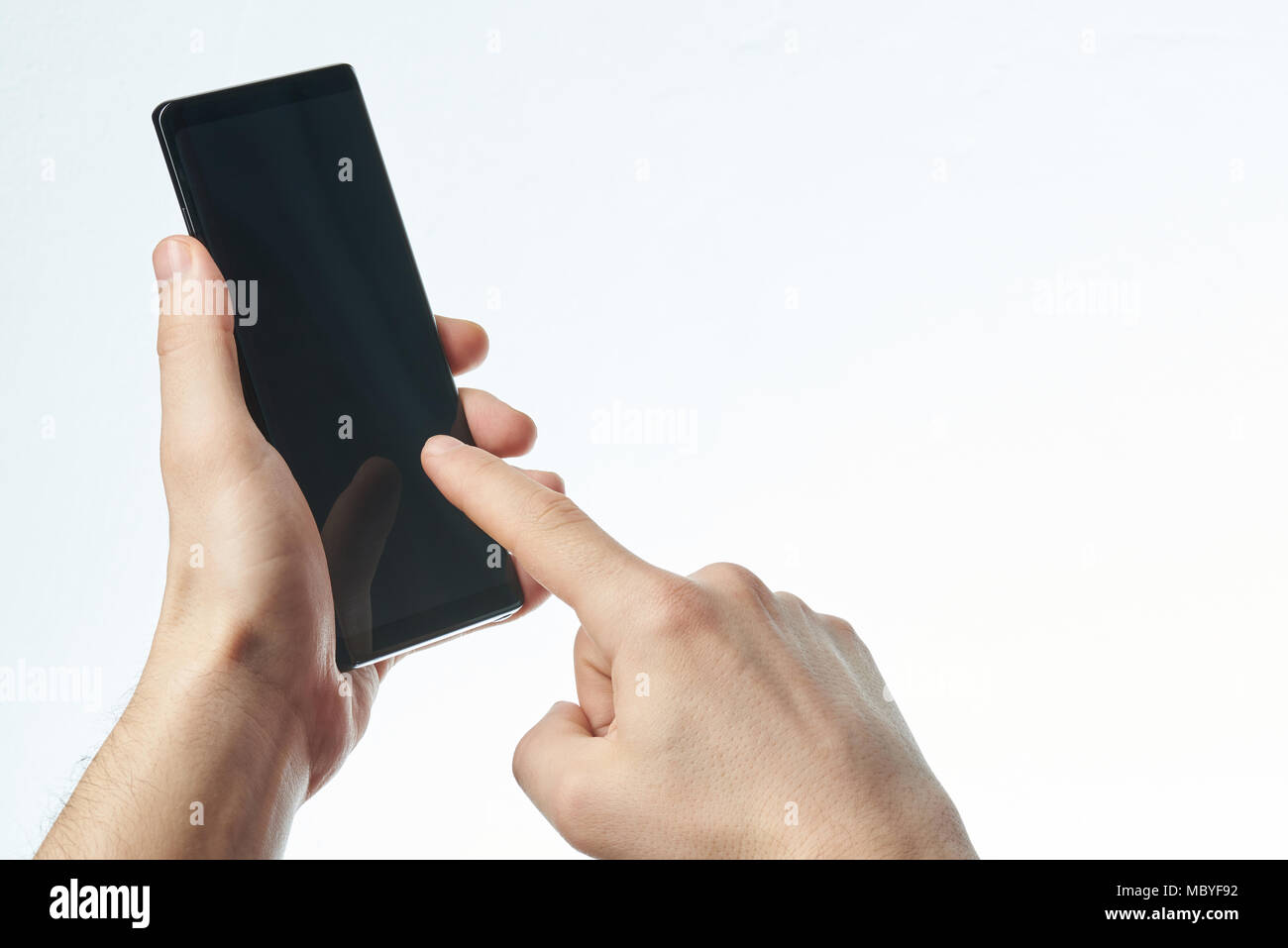 Close-up smartphone in hands with touchscreen isolated on white ...