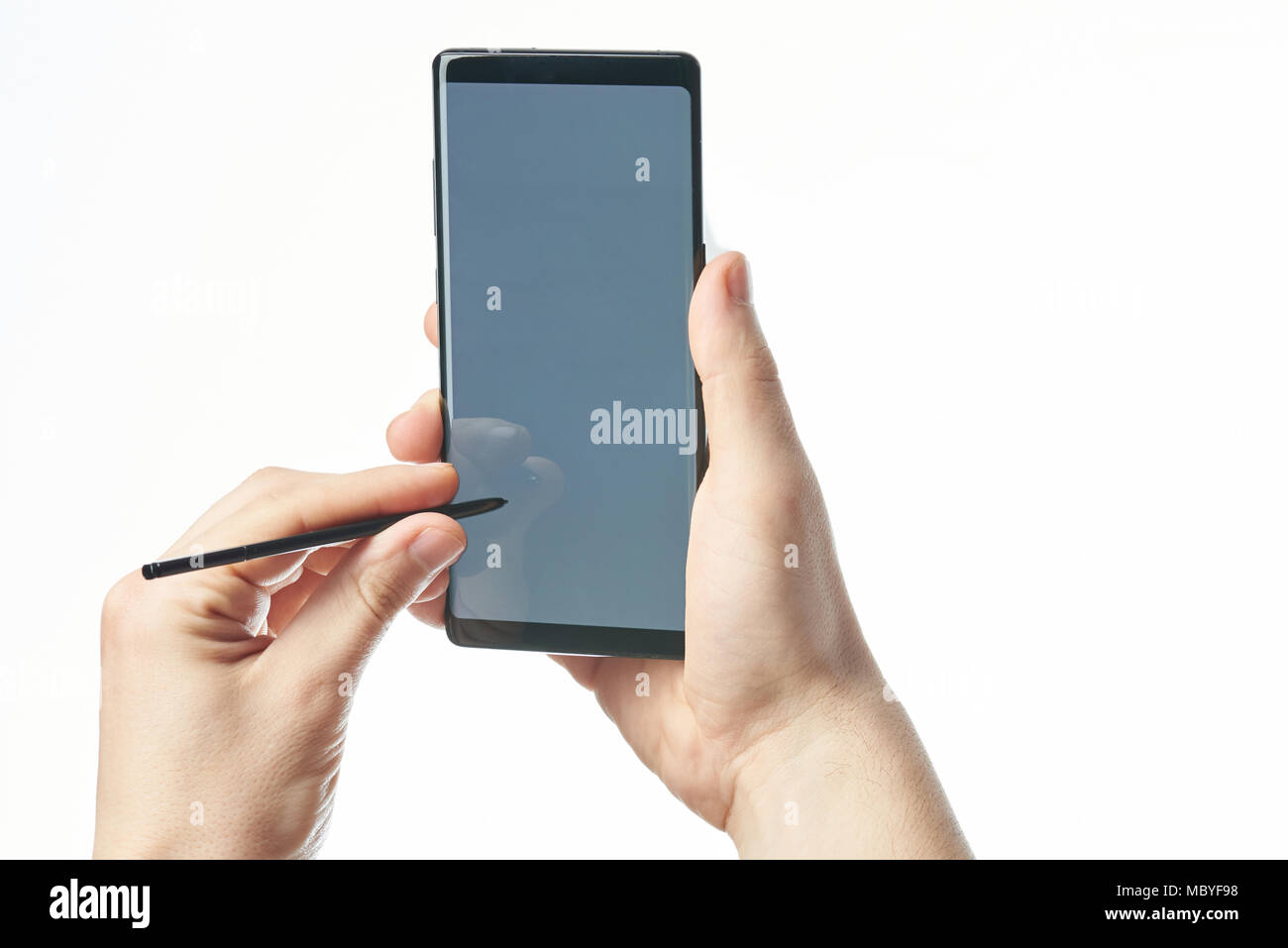 Mockup using smartphone with stylus in hand isolated on white ...