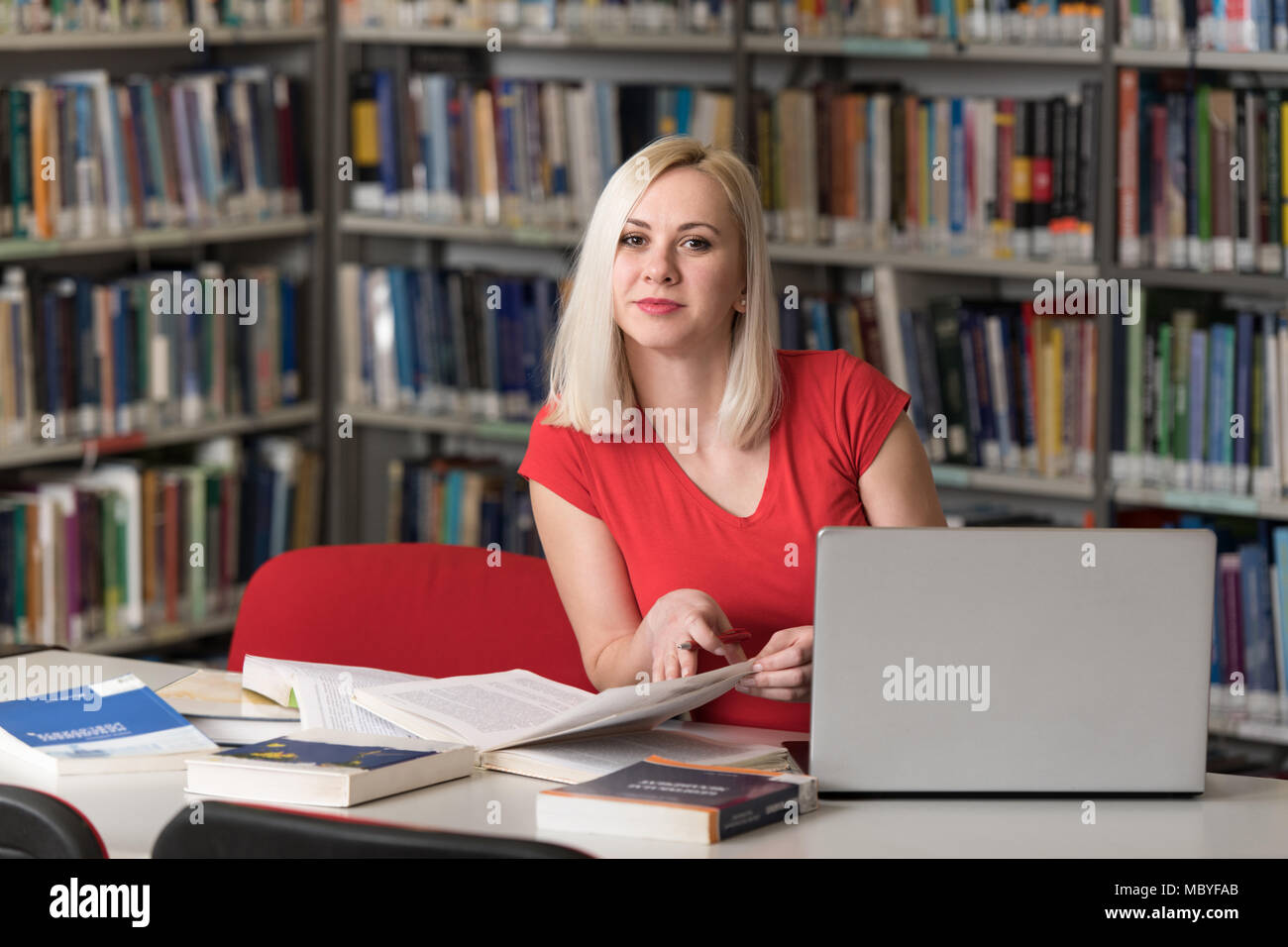 Girl doing school work in classroom hi-res stock photography and images ...