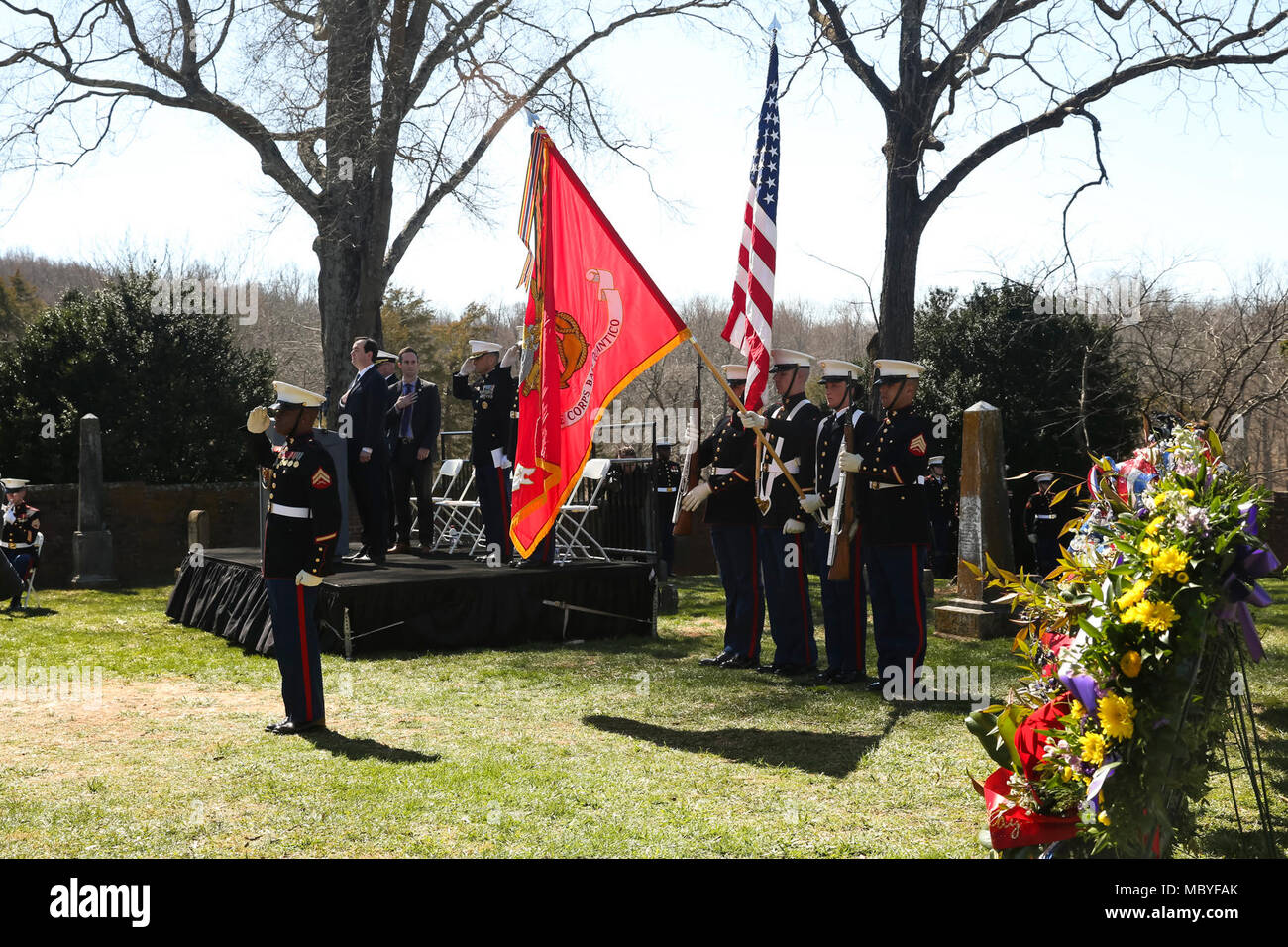 U.S. Marines and guests render honors for the National Anthem during the Presidential wreath ...