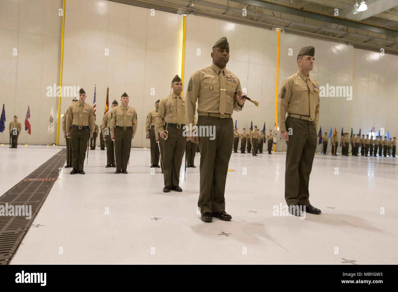 U.S. Marine Corps Sgt. Maj. Devon Lee, left, outgoing sergeant major ...