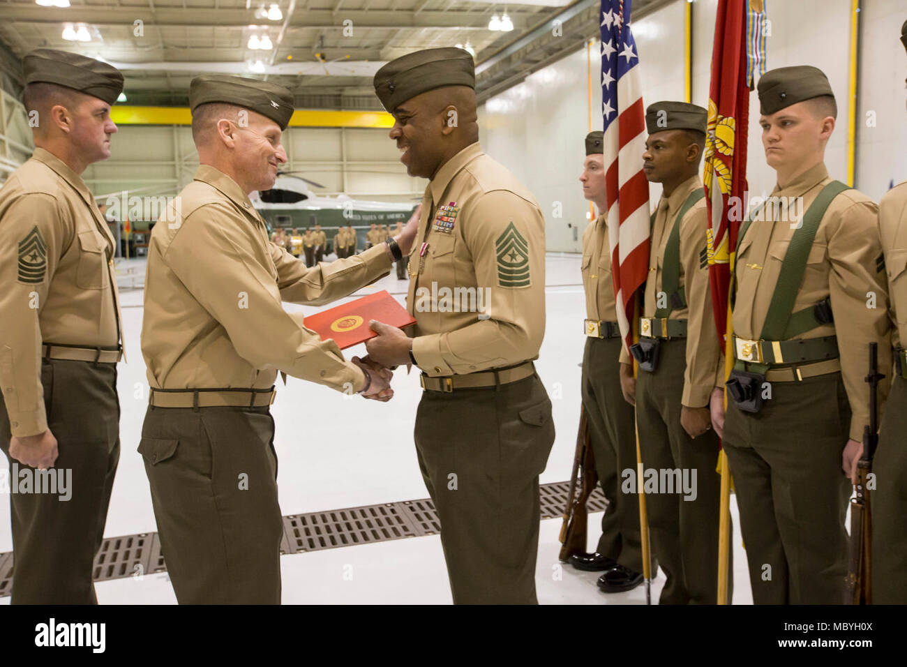 U.S. Marine Corps Col. Garrett Hoffman, center left, commanding officer ...