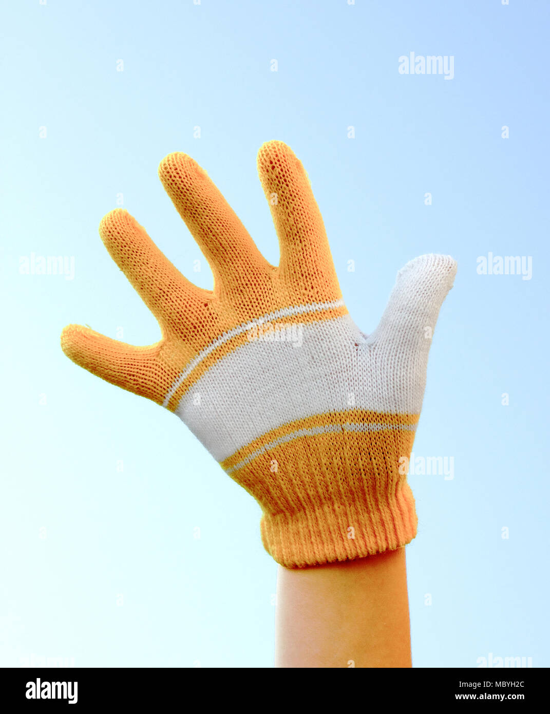 One hand in glove hi-res stock photography and images - Alamy