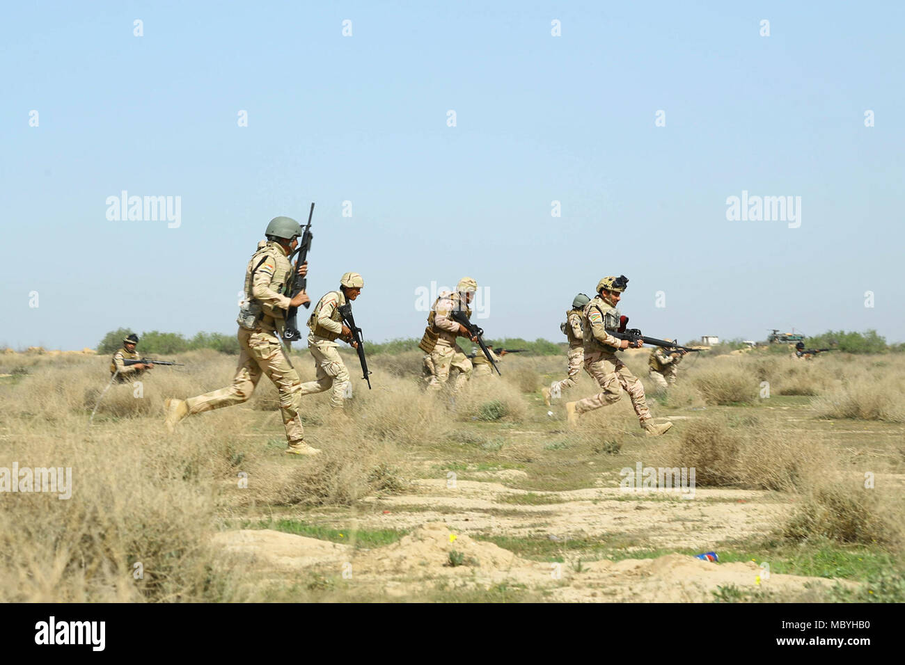 Iraqi soldiers from the 40th Brigade, conduct a live-fire exercise at ...