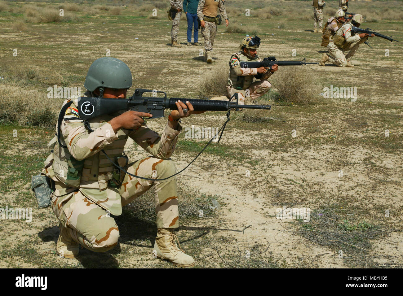 Iraqi soldiers from the 40th Brigade, conduct a live-fire exercise at ...