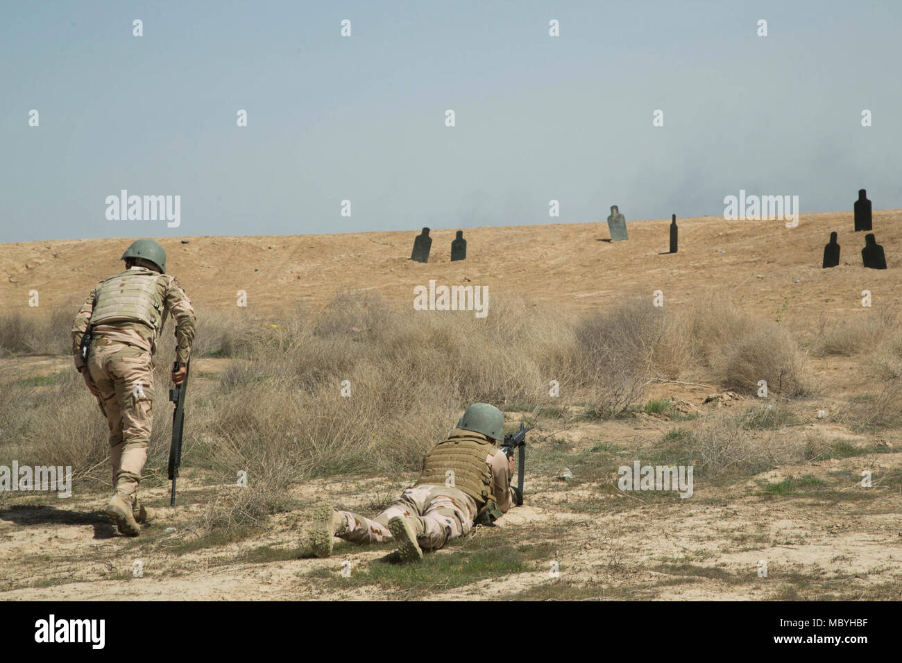 Iraqi soldiers from the 40th Brigade, conduct a live-fire exercise at ...