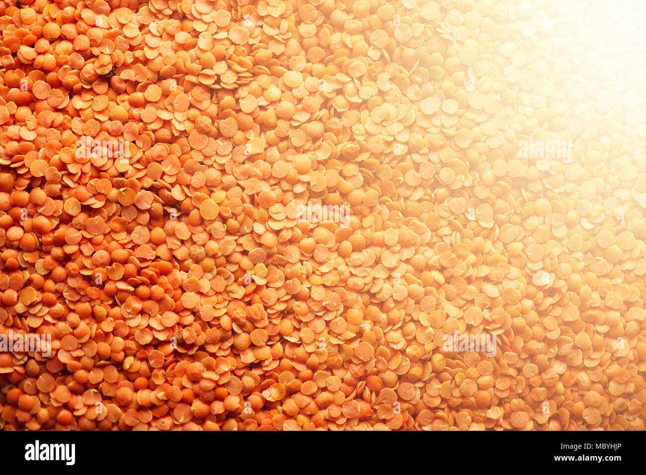Red raw organic lentils texture. Food ingredient background. Top view ...