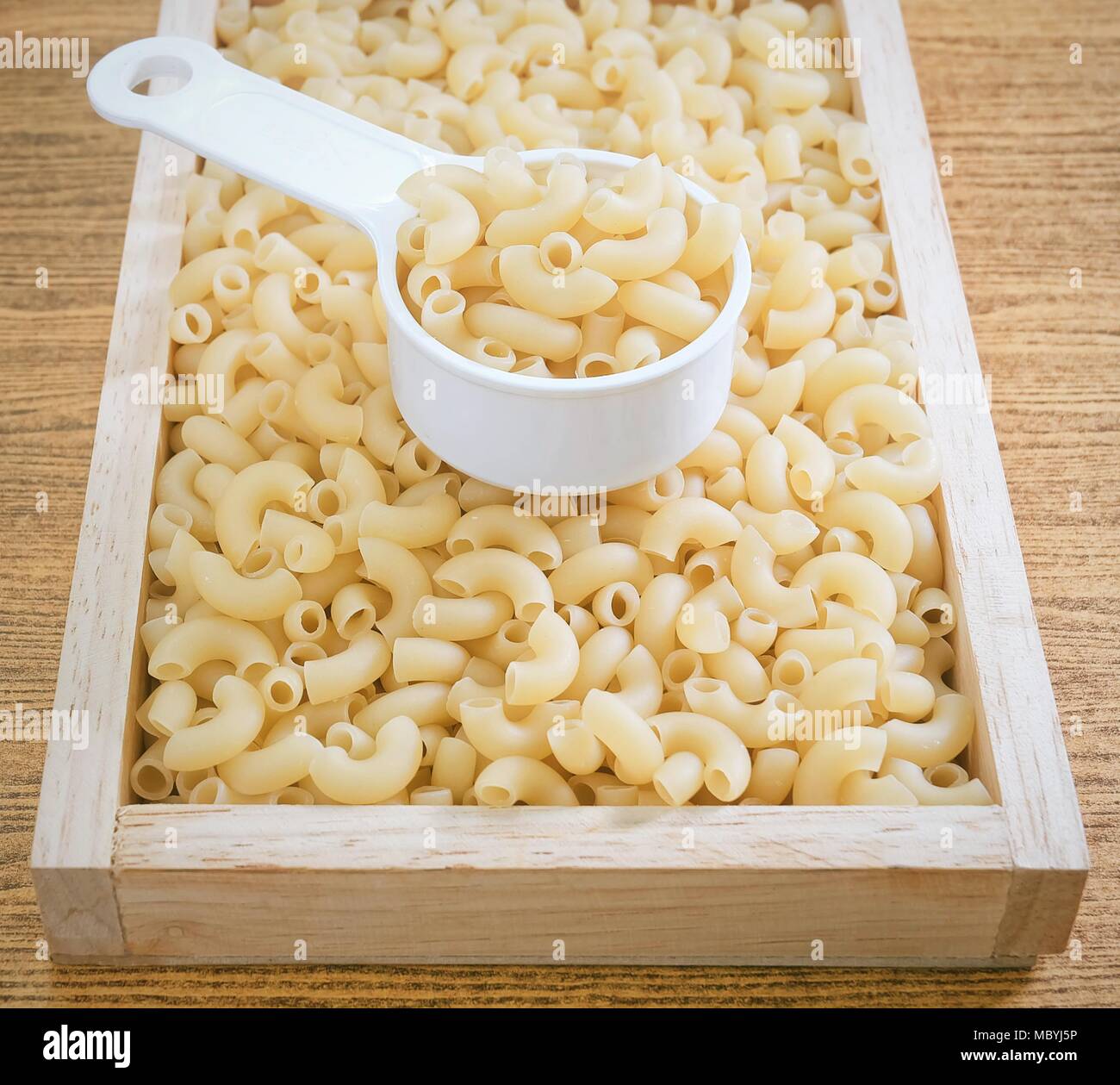 Food and Cuisine, Uncooked and Dried Elbow Macaroni or Gomiti Pasta in ...
