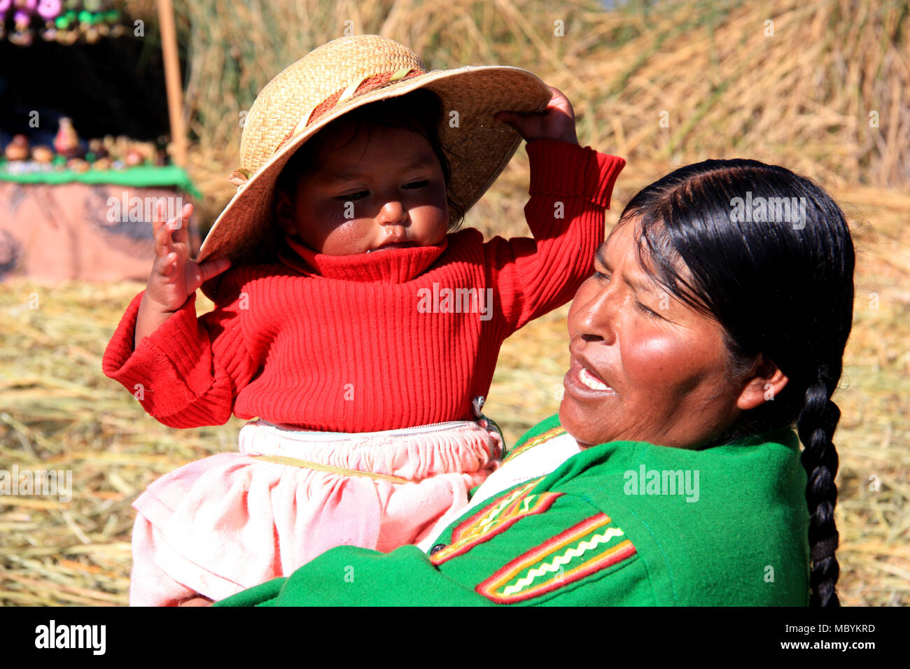 A Woman and her Child on the Isla los Uros, the Floating Islands of the ...