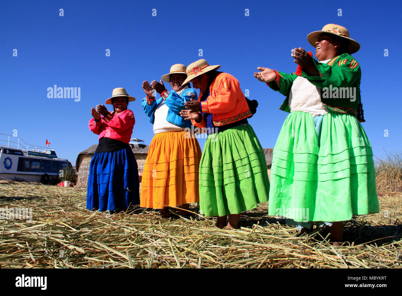 Women enjoying Life, singing, dancing and clapping on the Isla los Uros ...