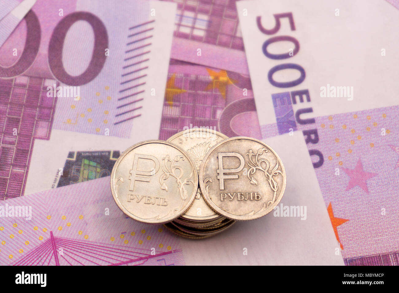 ruble coins and the symbol of the ruble and the numbers on Euro notes ...