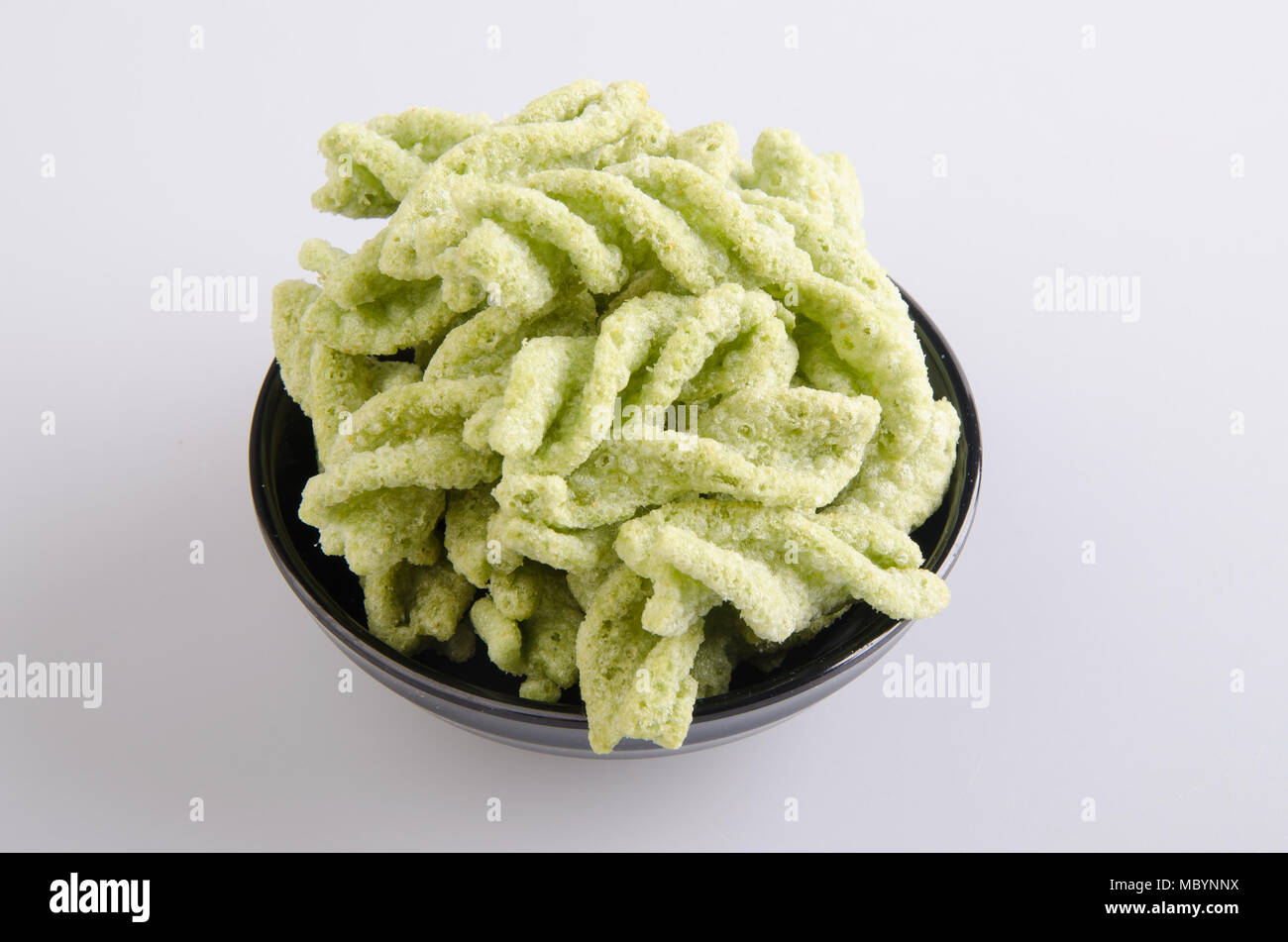 Junk food, green peas snack on a background Stock Photo - Alamy