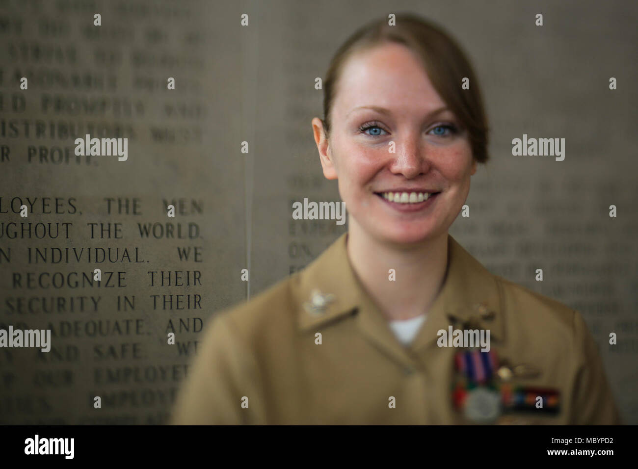 U.S. Navy EN2 Erin Wimmer stands for a portrait after receiving an ...