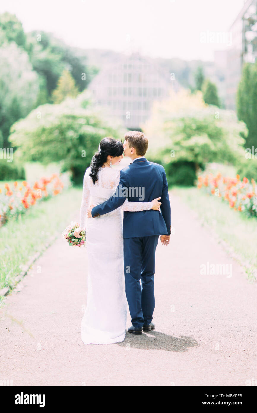 Married wedding couple walking away hi-res stock photography and images ...