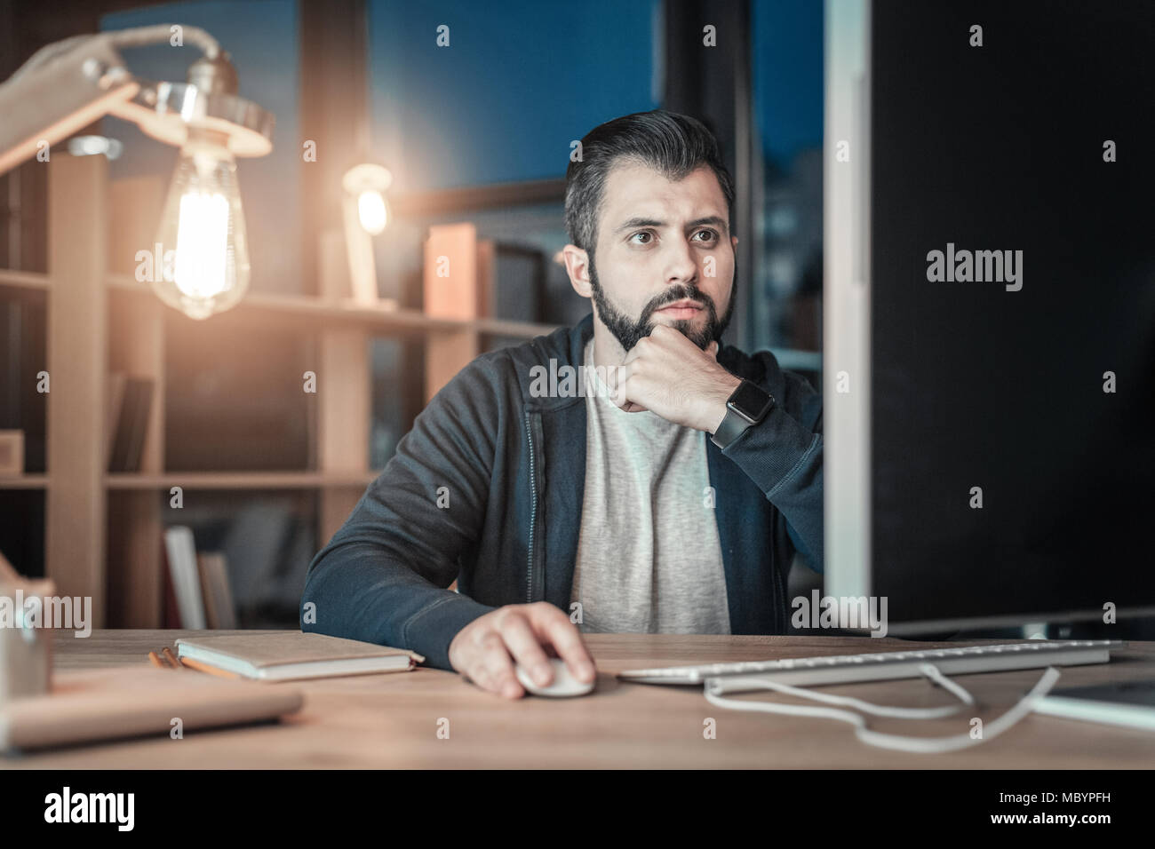 Pensive IT guy facing problem Stock Photo - Alamy