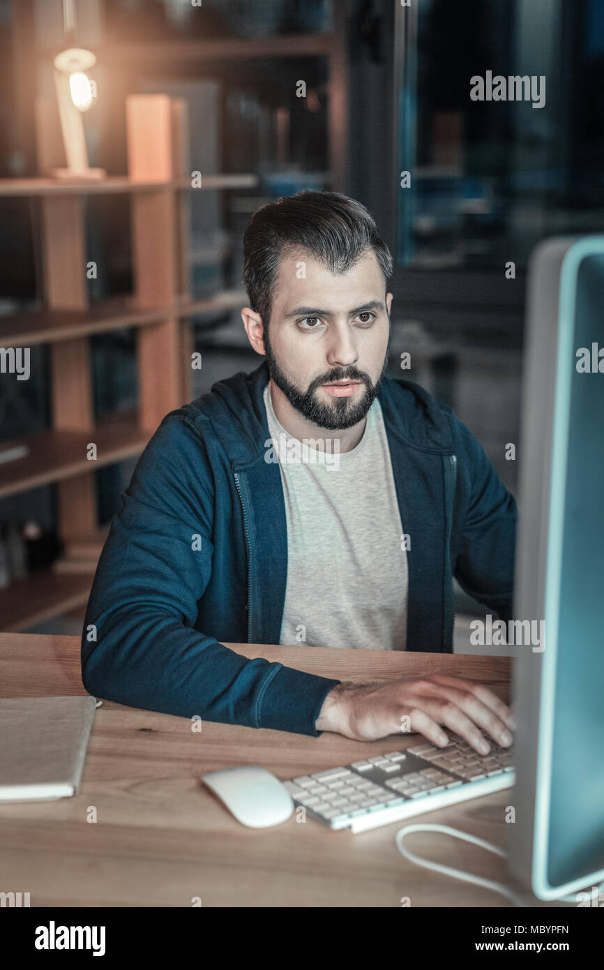 Young man programmer writing code hi-res stock photography and images ...