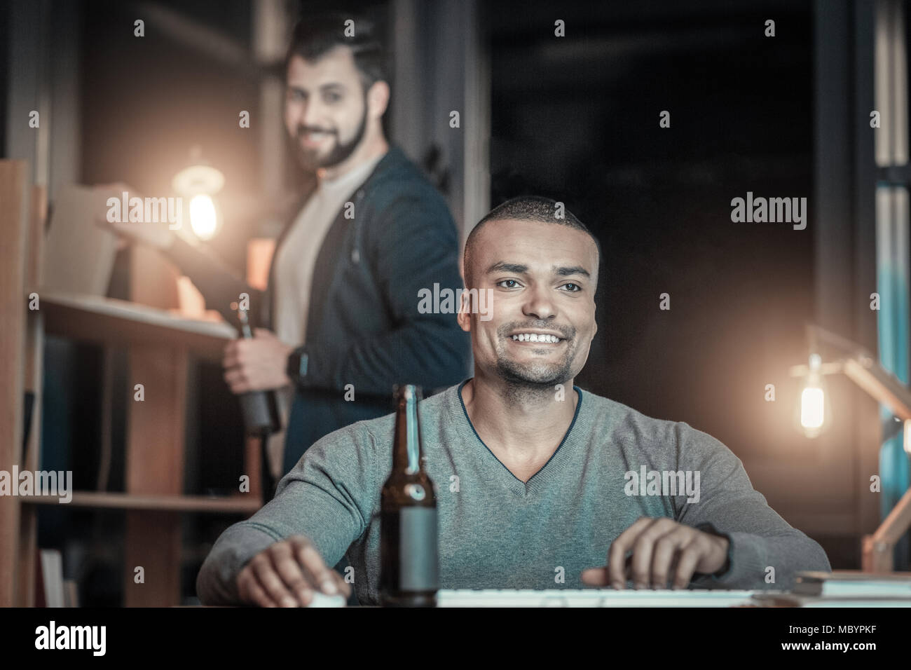 Positive IT guy programming application Stock Photo - Alamy