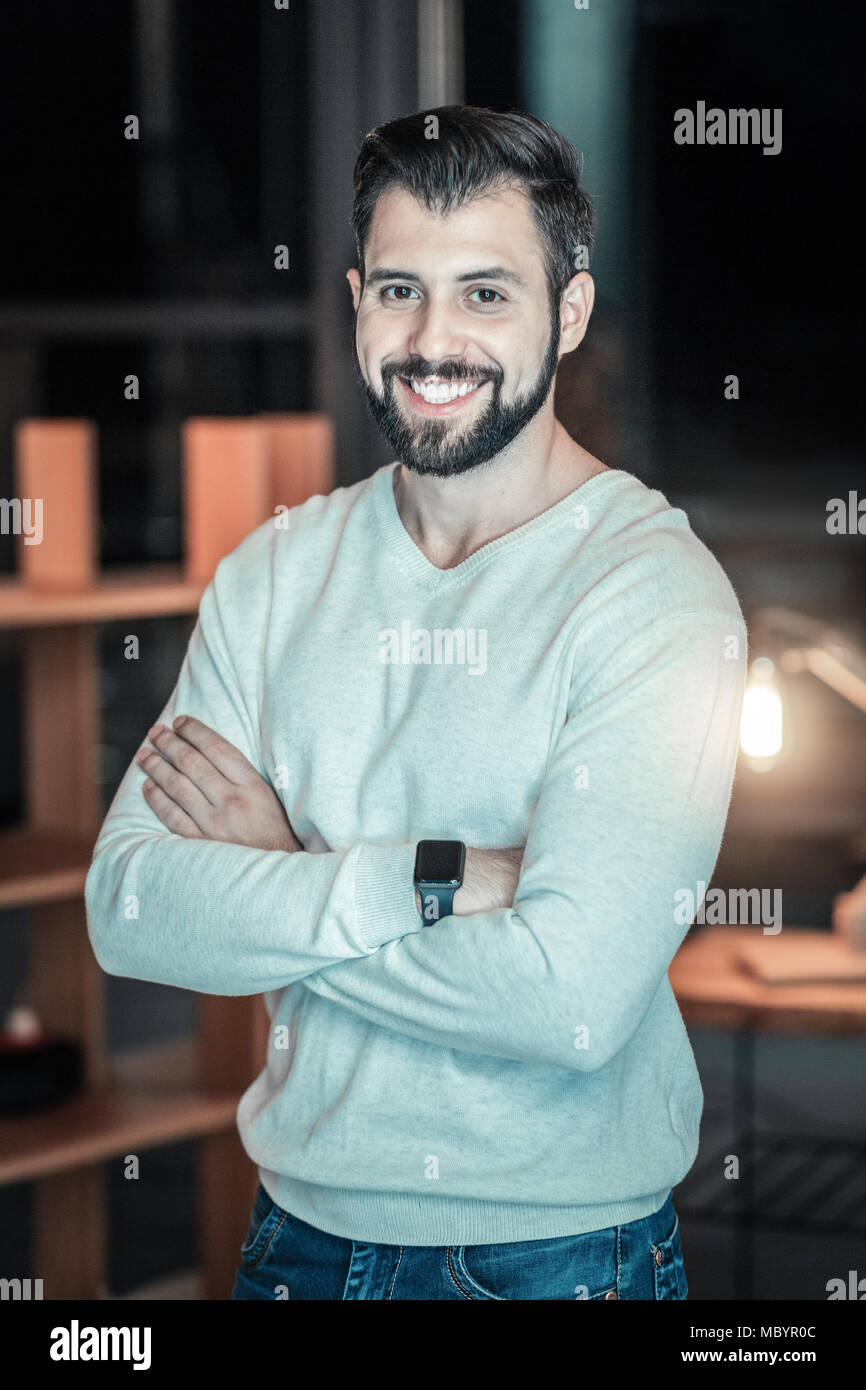 Bearded energetic man seducing with smile Stock Photo - Alamy