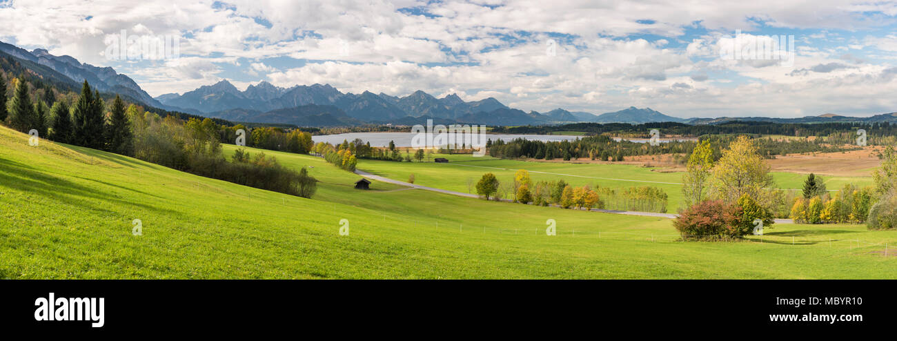 panoramic landscape in Bavaria with alps mountain range and lake ...