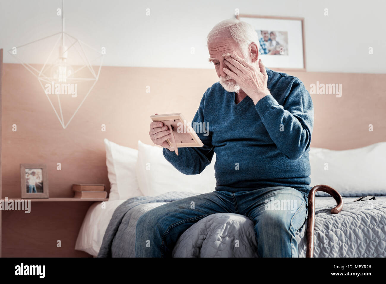 Cheerless aged man crying Stock Photo - Alamy