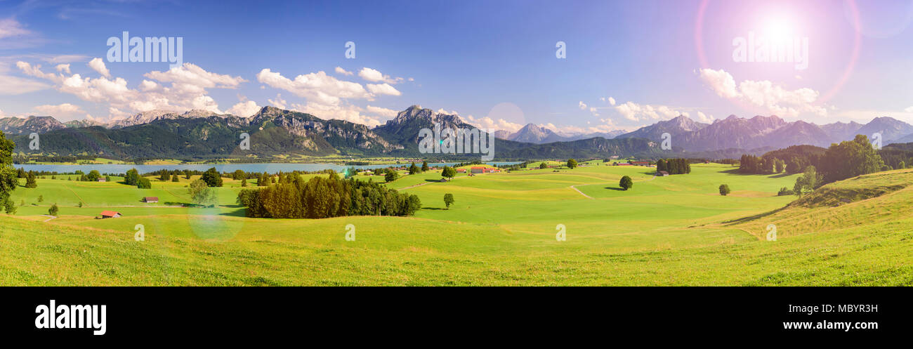 panoramic landscape in Bavaria with alps mountain range and lake ...