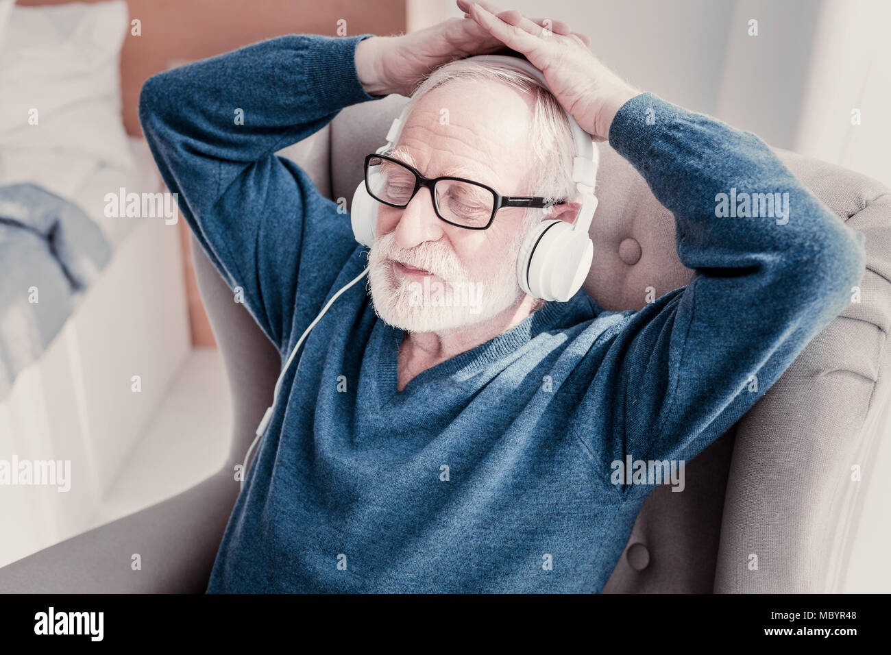 Positive happy man feeling relaxed Stock Photo - Alamy
