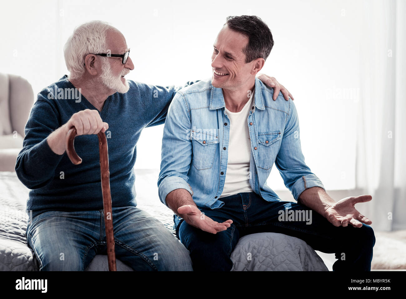 Happy positive father and son having a good time Stock Photo - Alamy