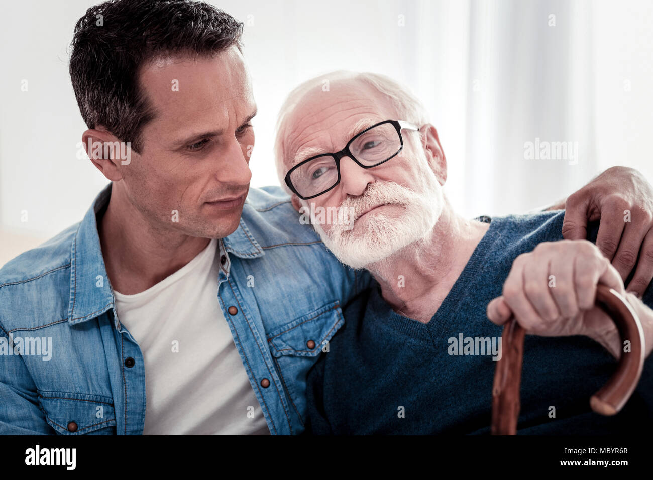 Joyful young man greeting his father Stock Photo - Alamy