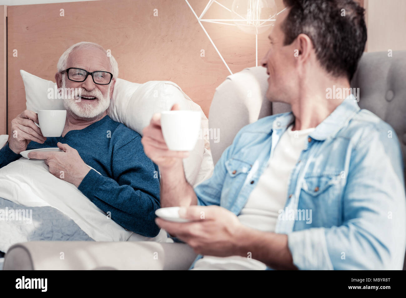 Happy cheerful father and son having a great time together Stock Photo ...