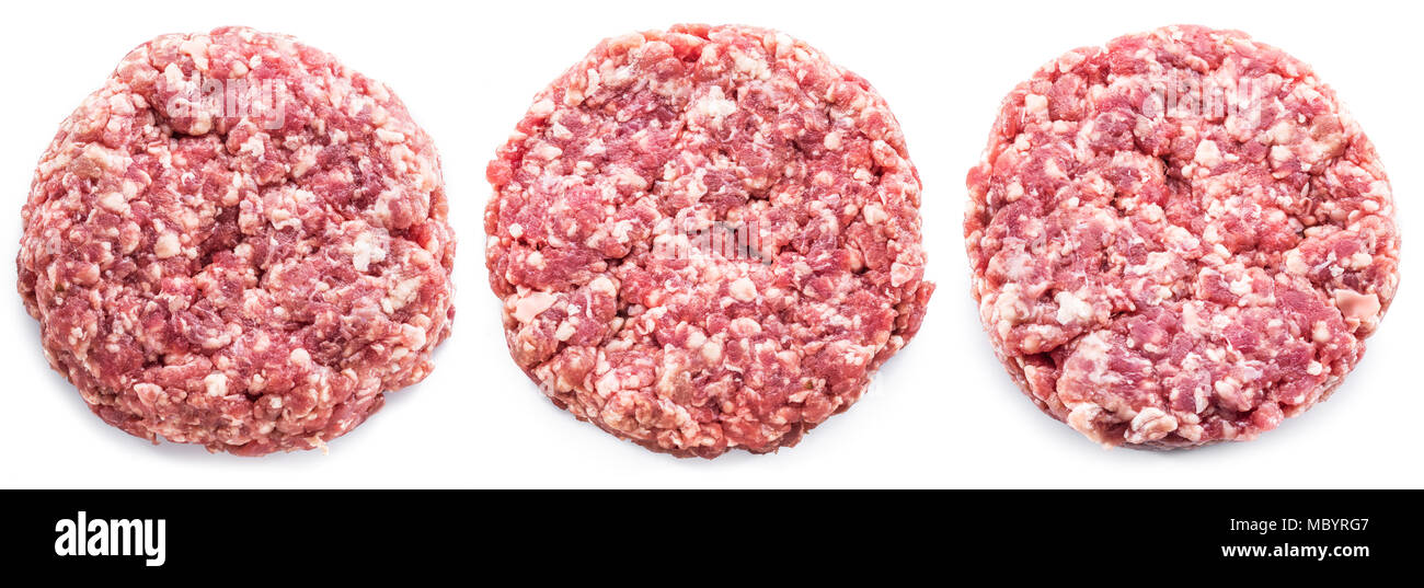 Three ground cutlets or raw hamburgers isolated on white background ...