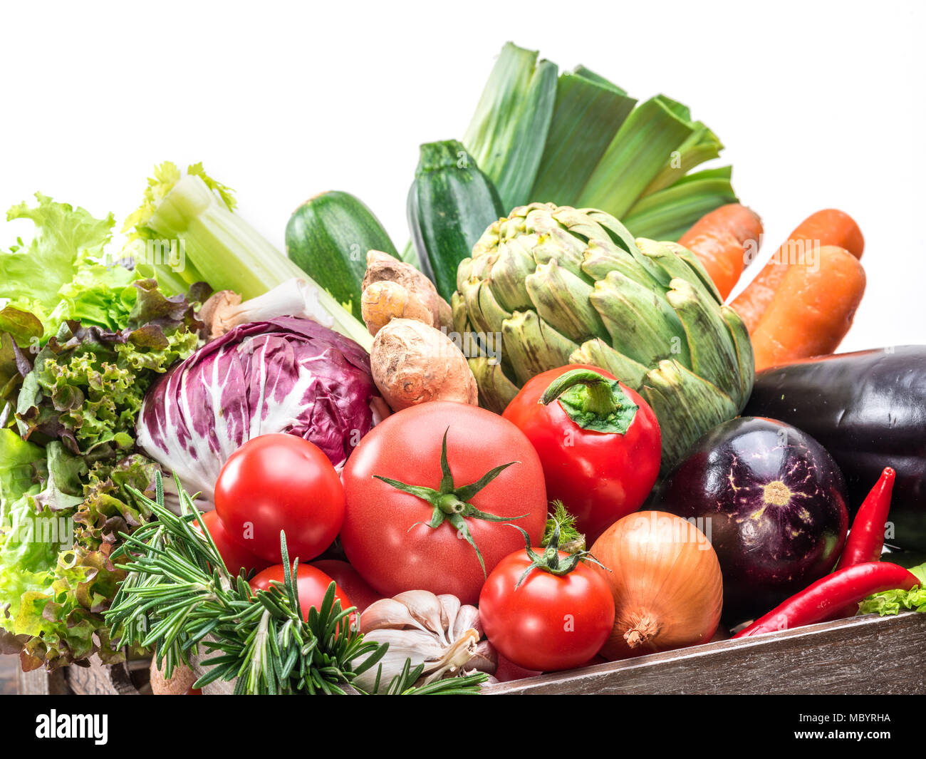 Fresh multi-colored vegetables in wooden crate Stock Photo - Alamy