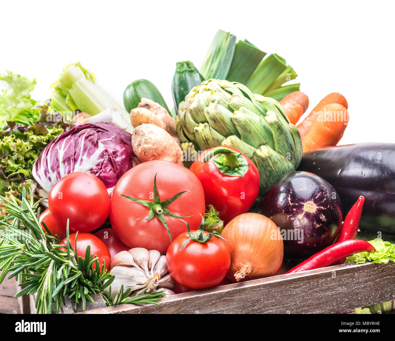 Fresh multi-colored vegetables in wooden crate Stock Photo - Alamy