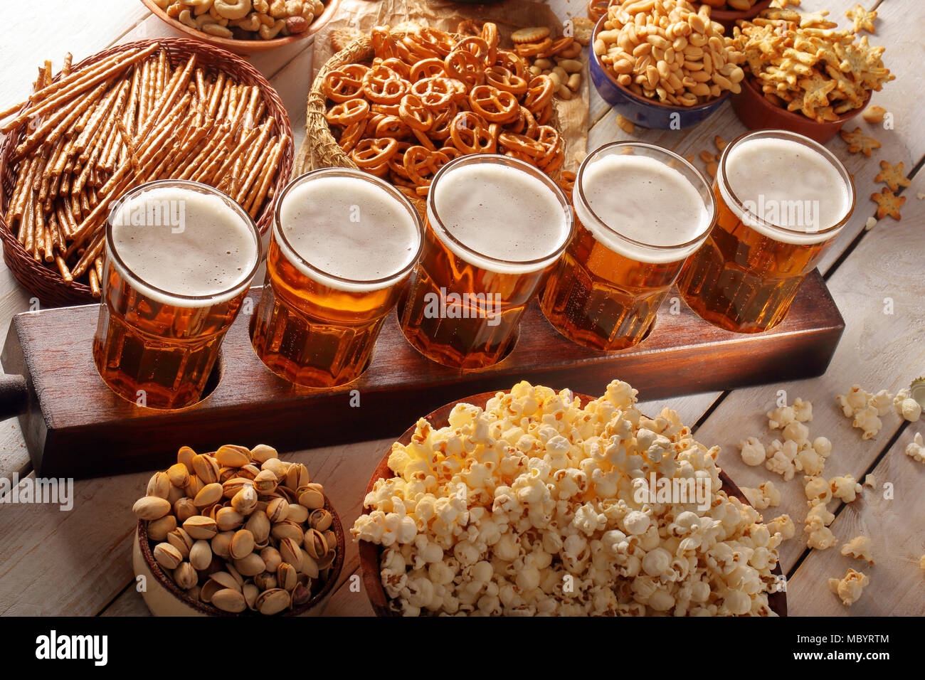 Lager beer and snacks on wooden table with copy space Stock Photo - Alamy