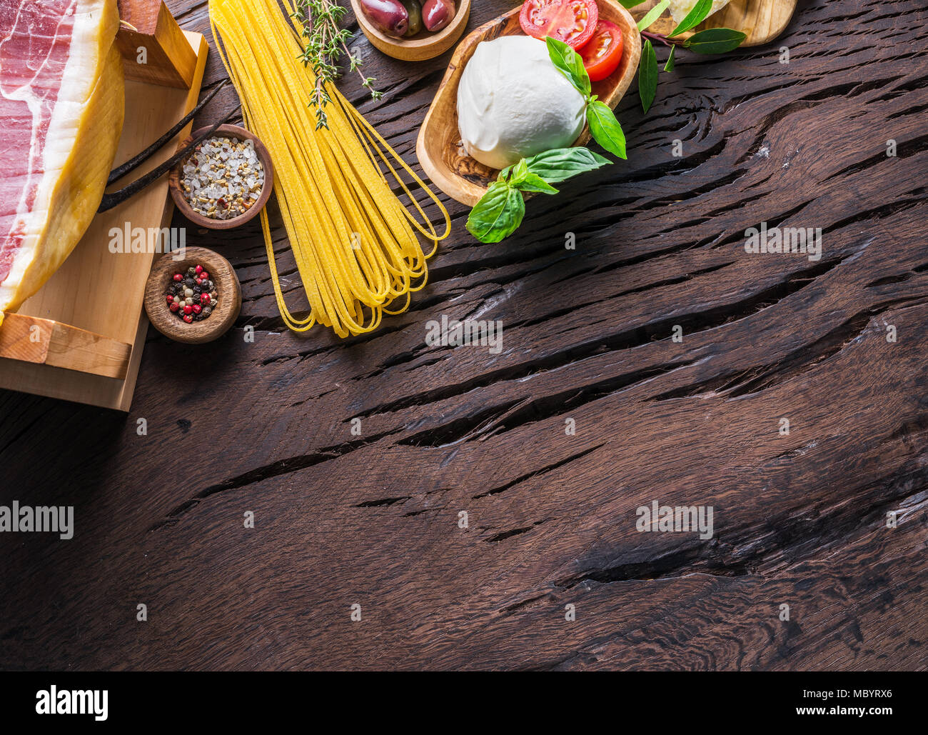 Variety of food on the wooden table. Top view Stock Photo - Alamy