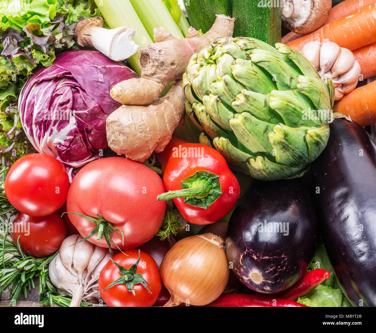 Fresh multi-colored vegetables in wooden crate. Top view Stock Photo ...