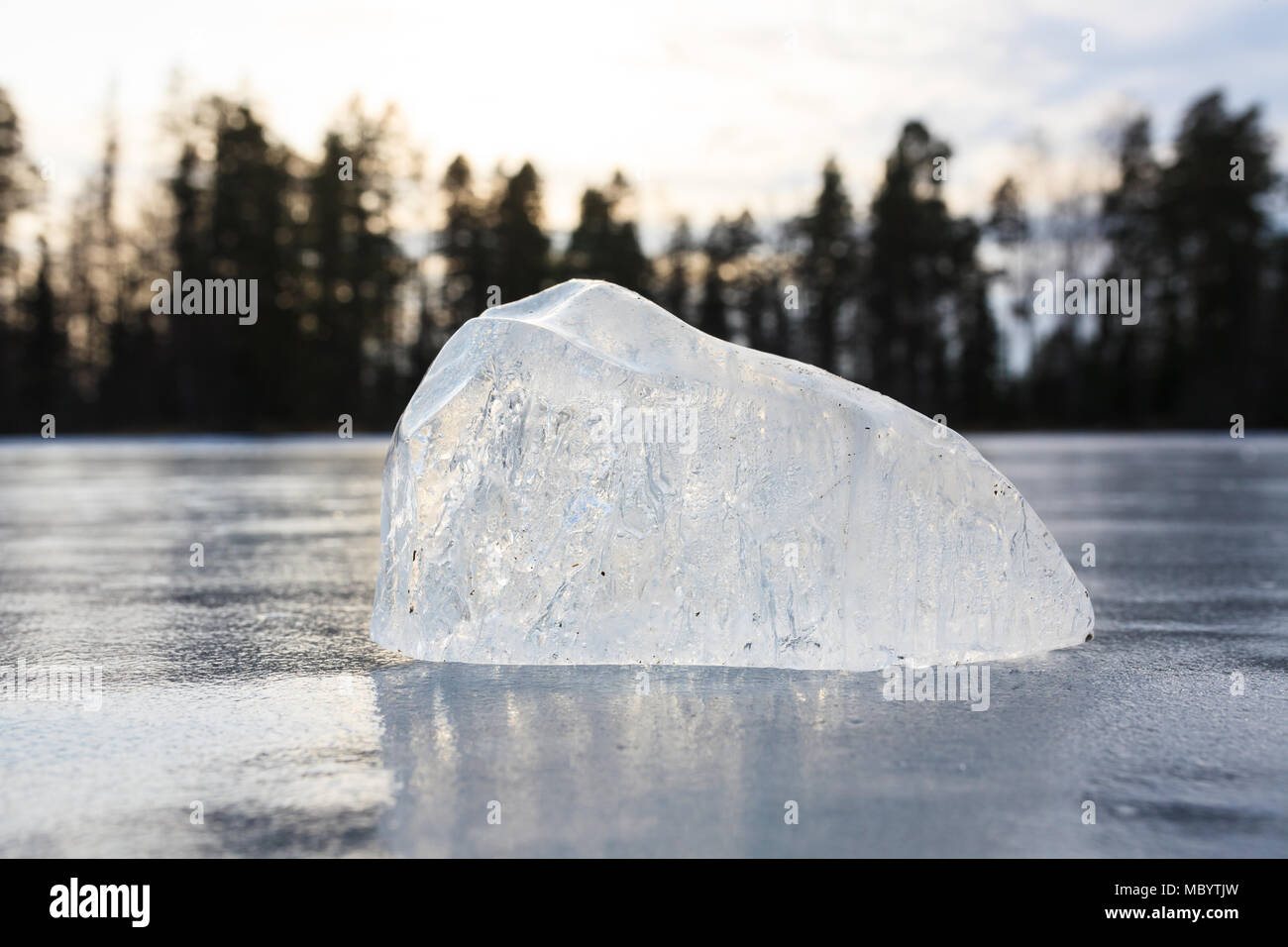 Chunk of ice in frozen lake Stock Photo - Alamy